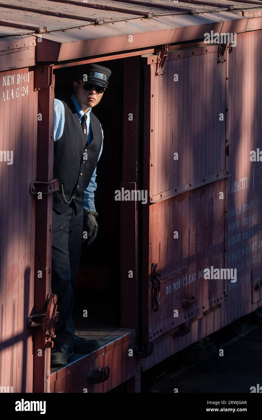 Railroad conductor with watch hi-res stock photography and images - Alamy