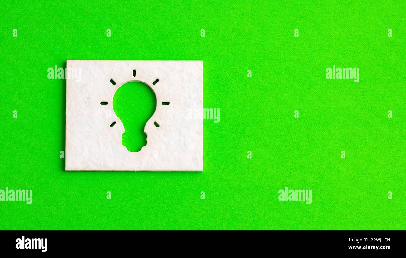 Light bulb on green color background - Creativity and innovation ...