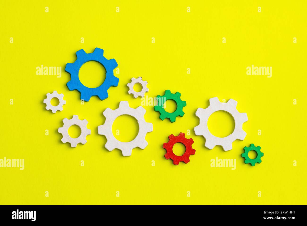 Business process and workflow automation - Gears on yellow background ...