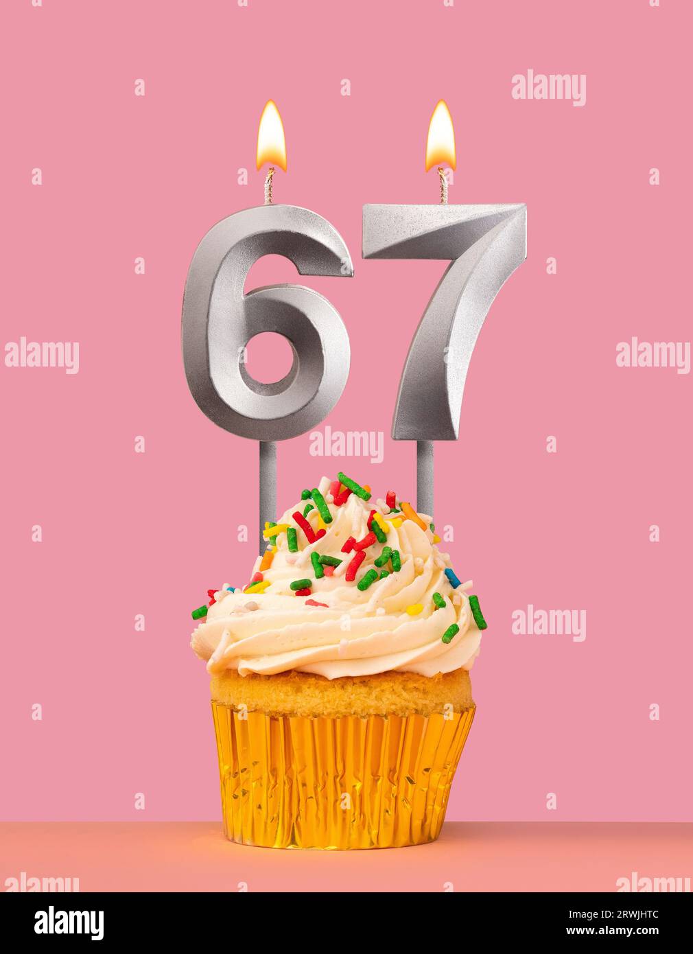 Birthday card with cupcake and candle number 67 Stock Photo - Alamy