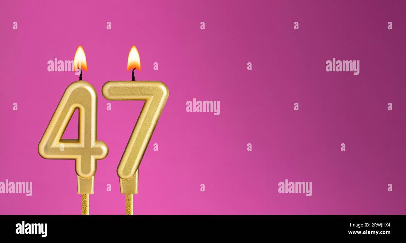 Candle number 47 in purple background - birthday card Stock Photo - Alamy