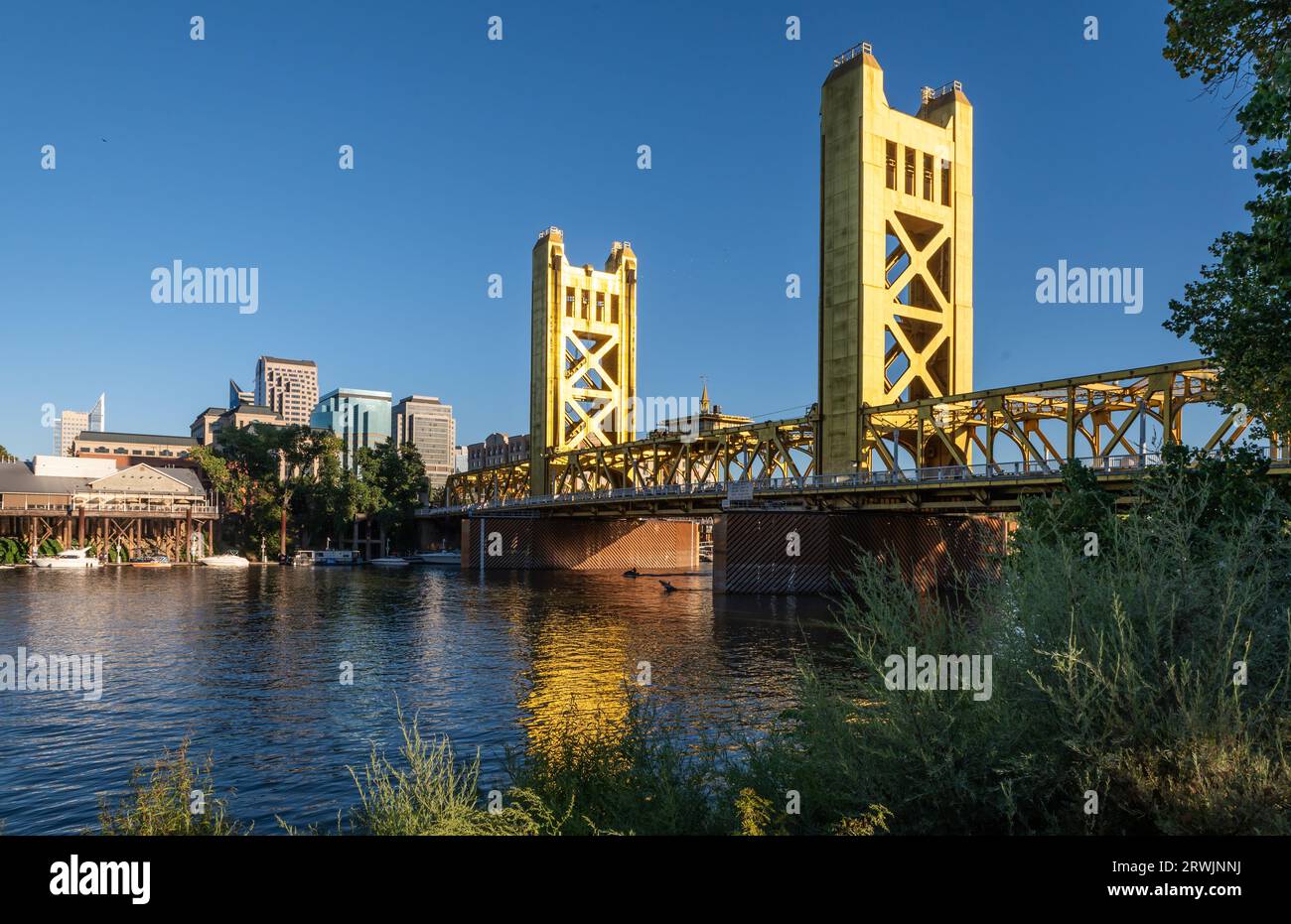 Photo of the golden Tower Bridge over the Sacramento River. The bridge ...