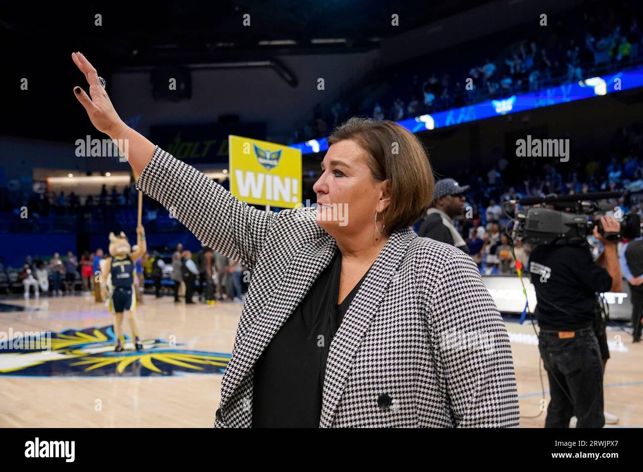 Dallas Wings coach Latricia Trammell waves to fans as she leaves the ...