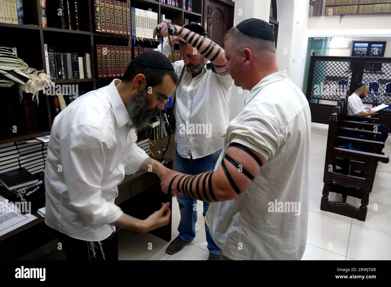 Non Exclusive: ODESA, UKRAINE - SEPTEMBER 15, 2023 - A man helps place an arm-tefillah during ...