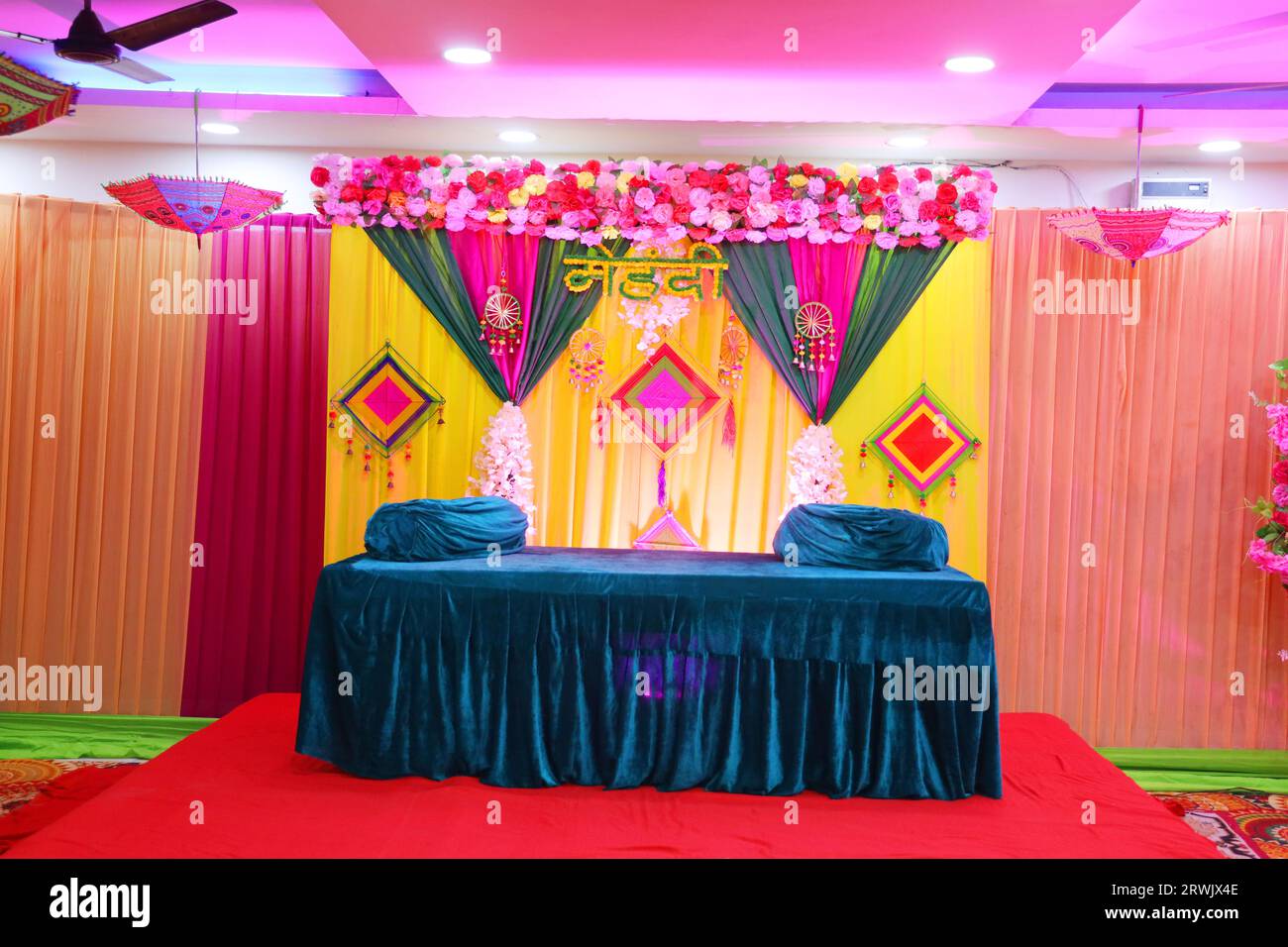 Beautiful mehendi function indoor venue at india Stock Photo - Alamy
