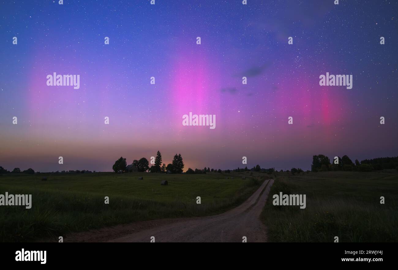 Northern lights - Aurora borealis dancing in the night sky Stock Photo ...