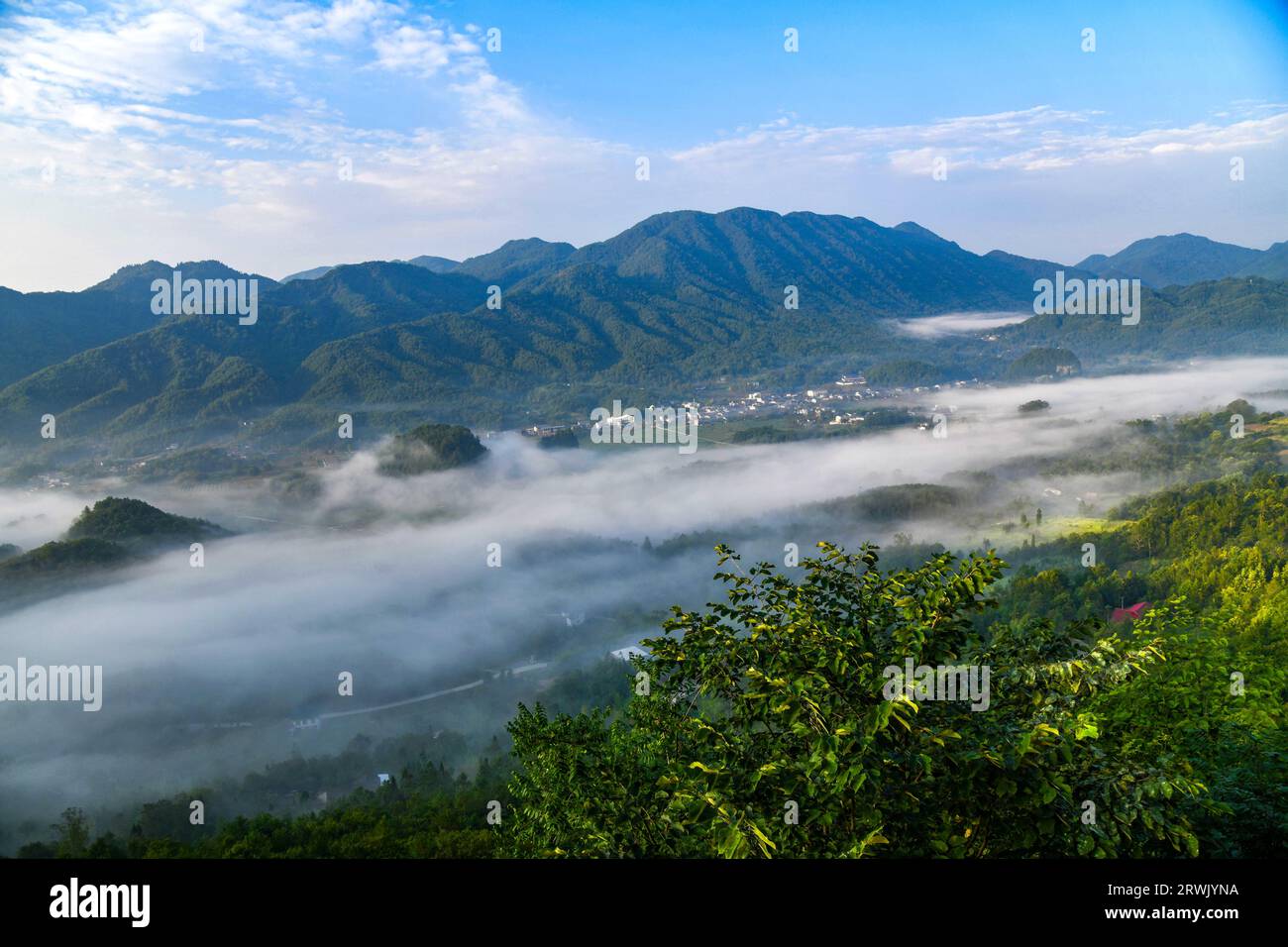 Morning fog shrouding the Kongshan National Forest Park in Tongjiang ...