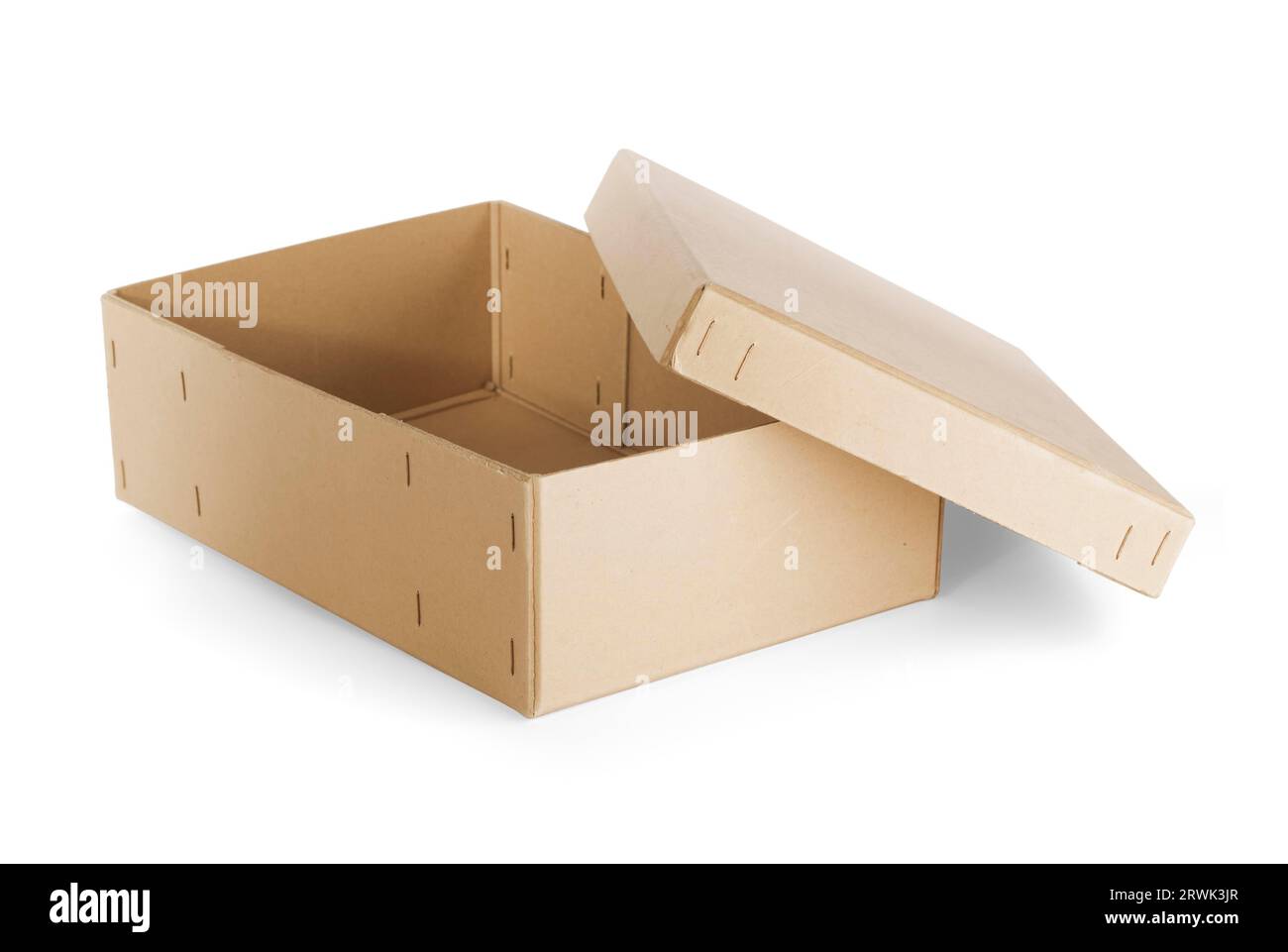 Vintage open cardboard shoe box isolated on white with natural shadows ...