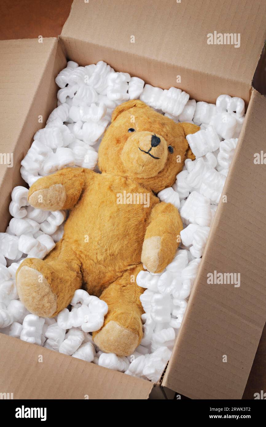 Vintage teddy bear safely in a cardboard box Stock Photo - Alamy