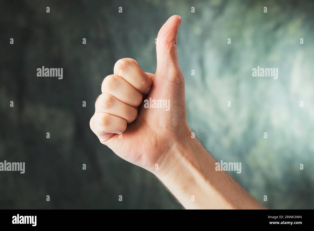 Man doing a Thumb up hand gesture Stock Photo - Alamy
