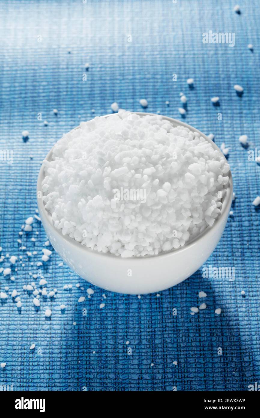 Coarse grained salt used in pepper mills and grinders in a small bowl ...