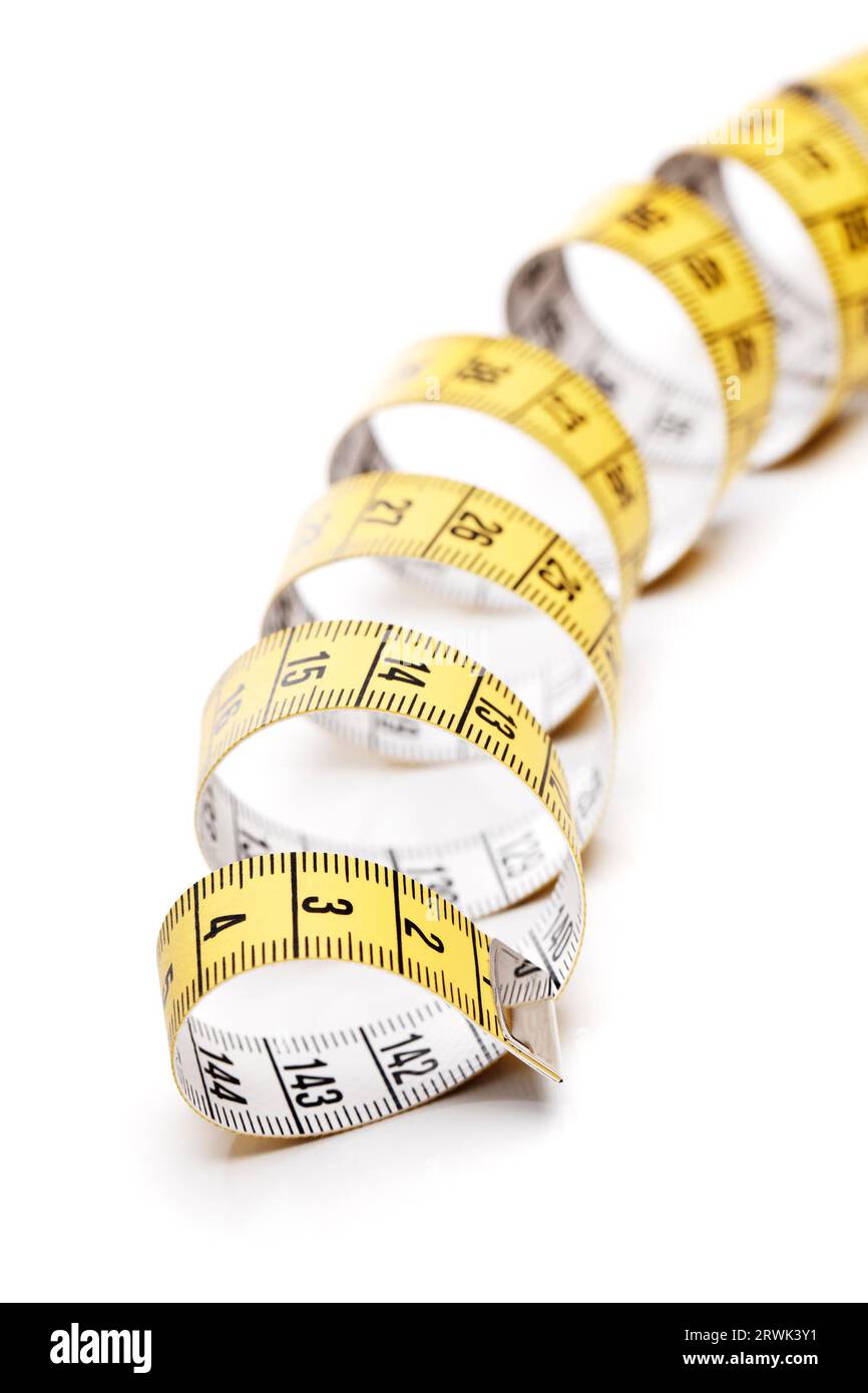 A yellow and white tape measure, metric system Stock Photo - Alamy