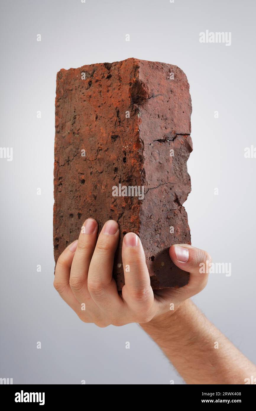 Brick grab hi-res stock photography and images - Alamy