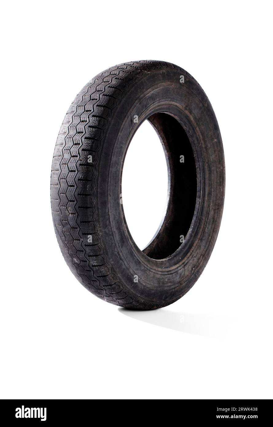 Old worn and weathered car tyre on white with natural shadow Stock ...