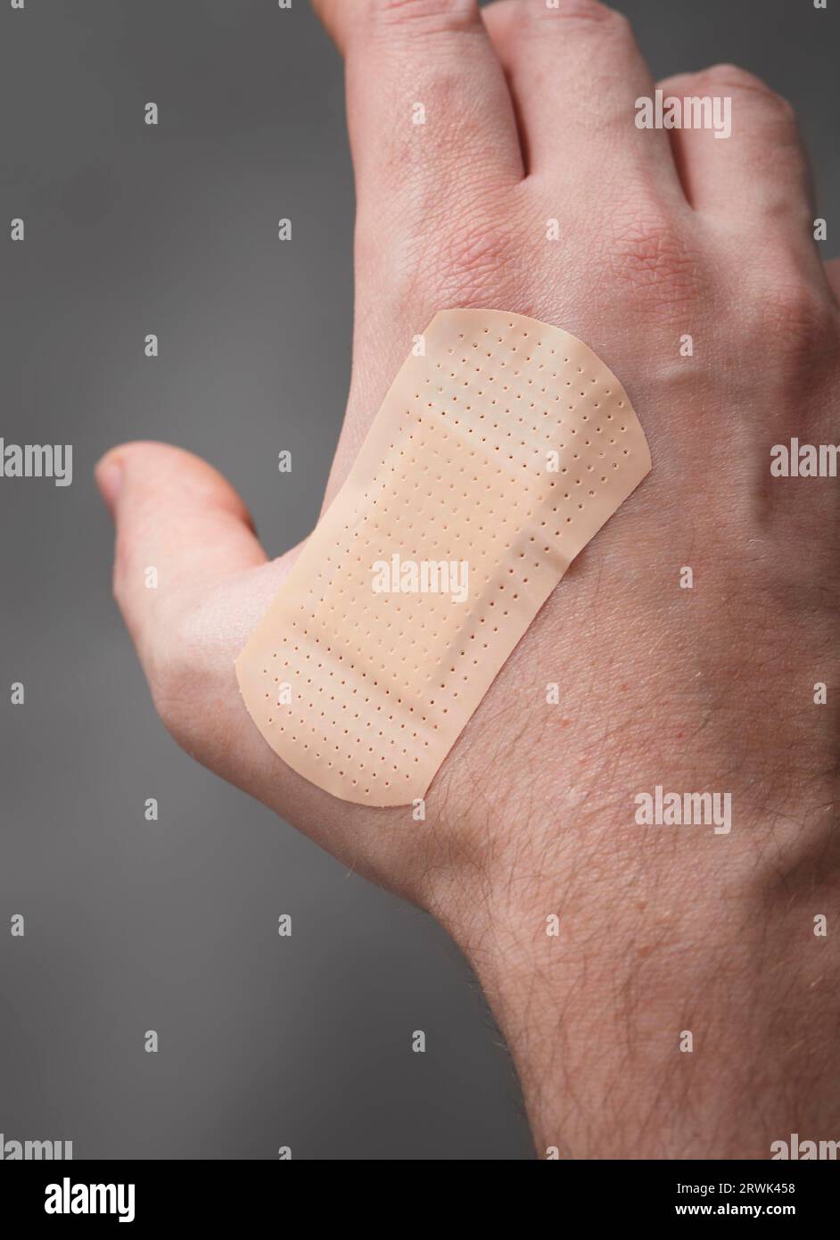 Hand with plastic adhesive bandage Stock Photo - Alamy