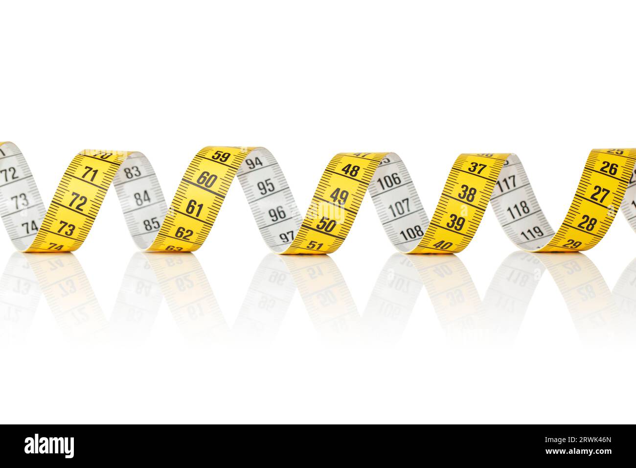 Yellow and white metric tape measure on white reflecting background ...