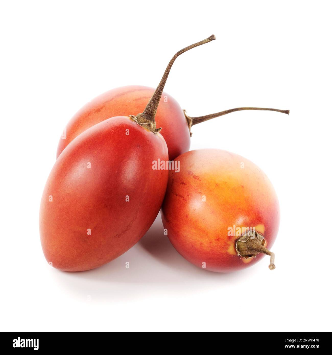 Three tamarillo fruits on white with shadow Stock Photo - Alamy
