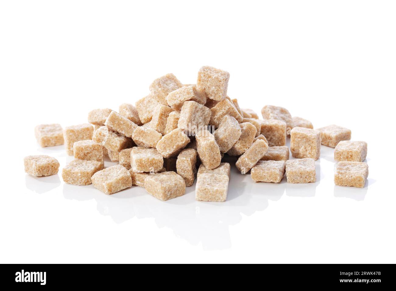 Natural brown sugar cubes on white reflecting background Stock Photo ...