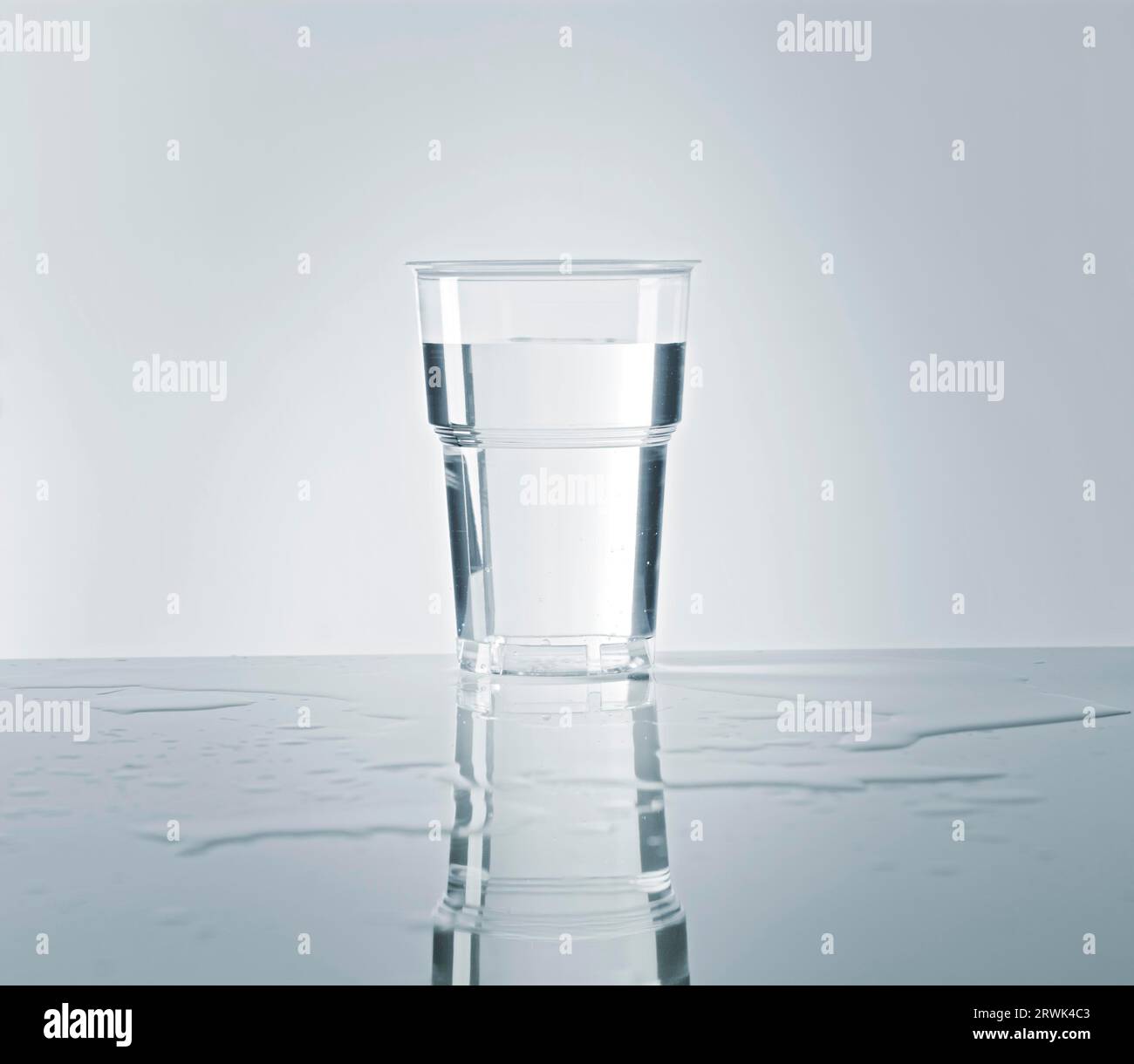 A Disposable plastic cup filled with water Stock Photo - Alamy