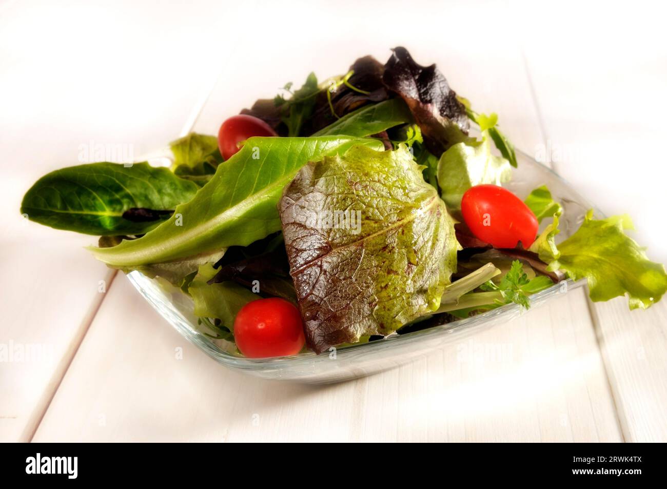Leaf salad on a glass plate Stock Photo - Alamy