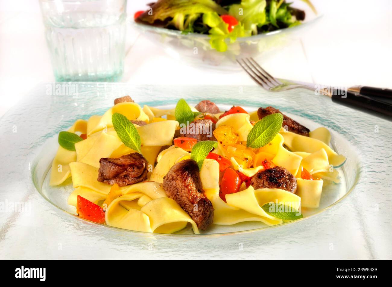 Ribbon noodles with beef fillet Stock Photo - Alamy