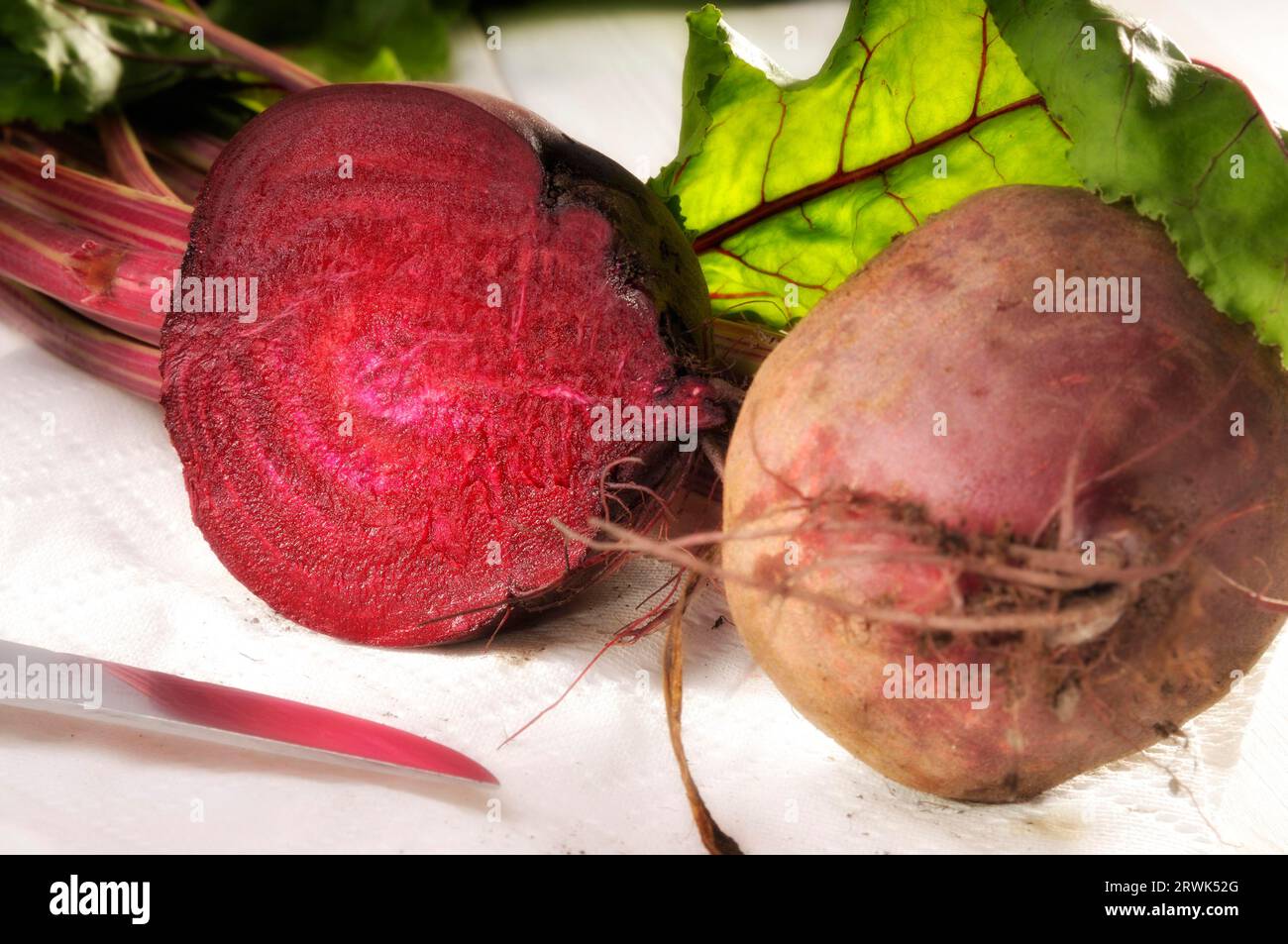 Beetroot tubers. One whole one cut through Stock Photo - Alamy