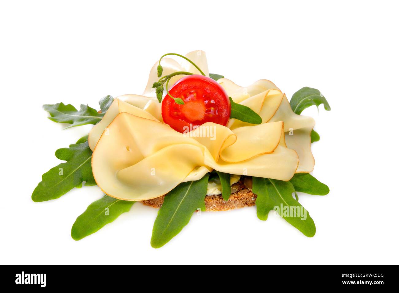 Cheese bread with rocket and tomato as a cut out Stock Photo - Alamy