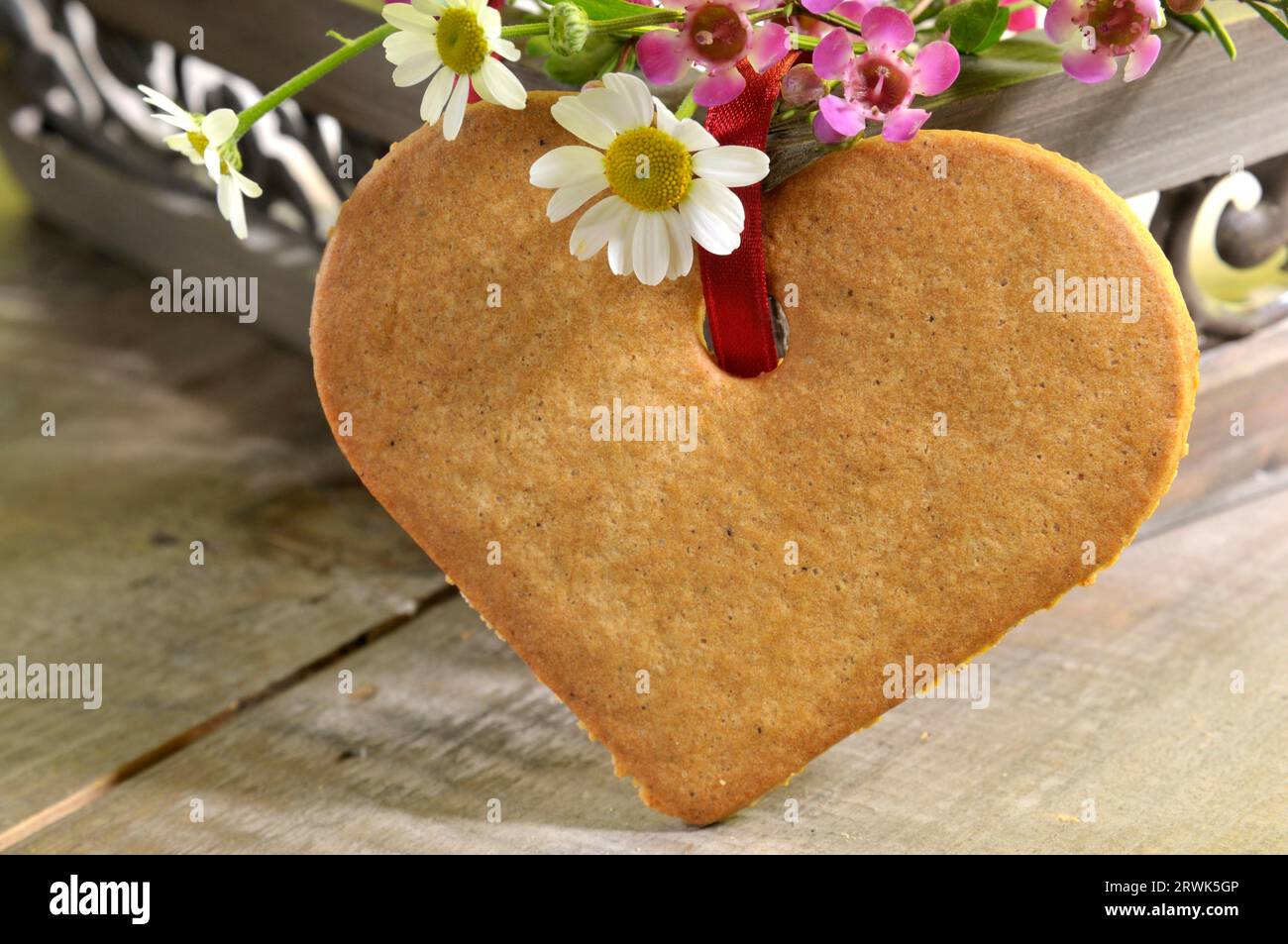 Baked Heart Decorated with Country Style Flowers Stock Photo - Alamy