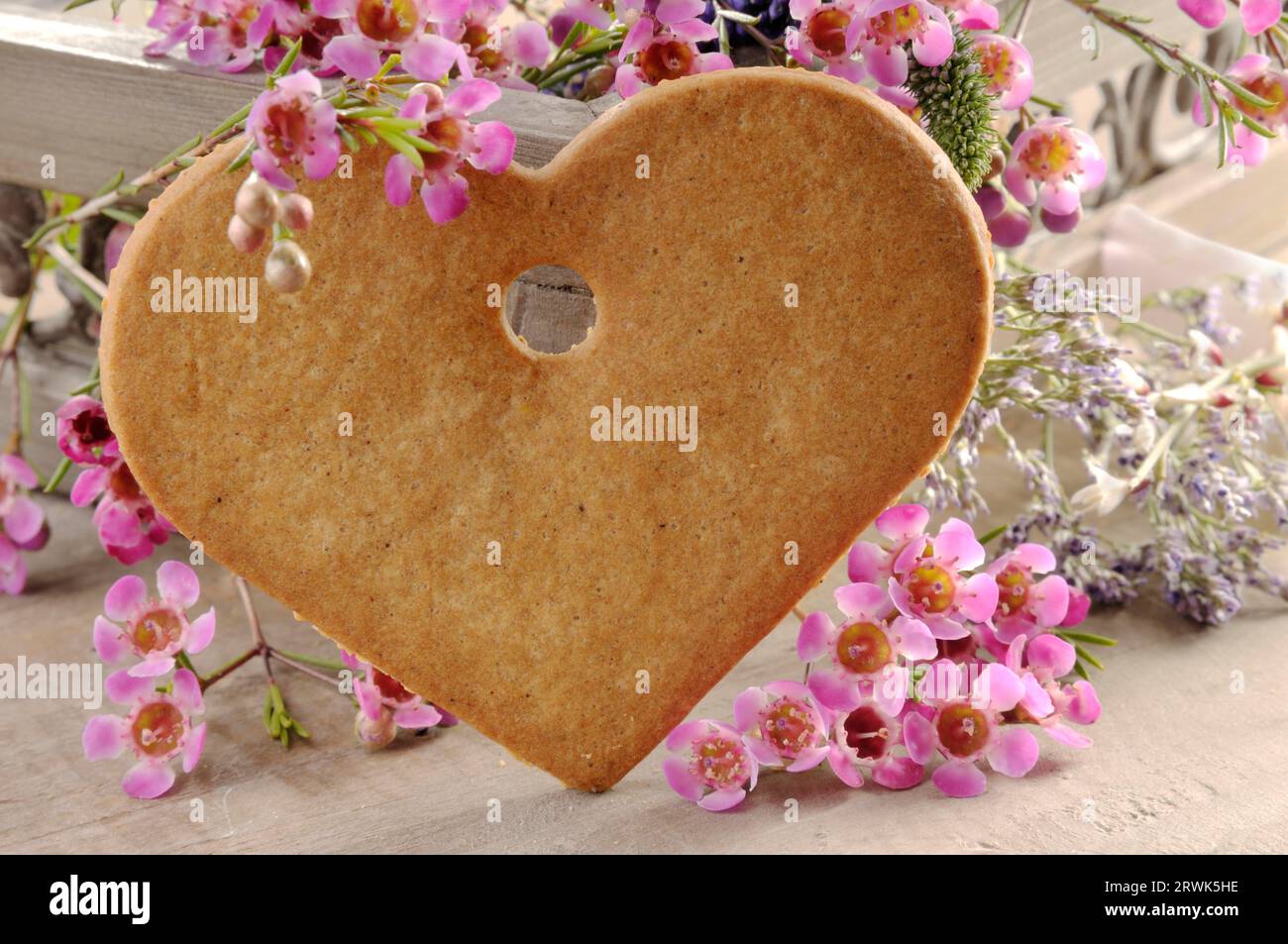 Baked Heart Decorated with Country Style Flowers Stock Photo - Alamy