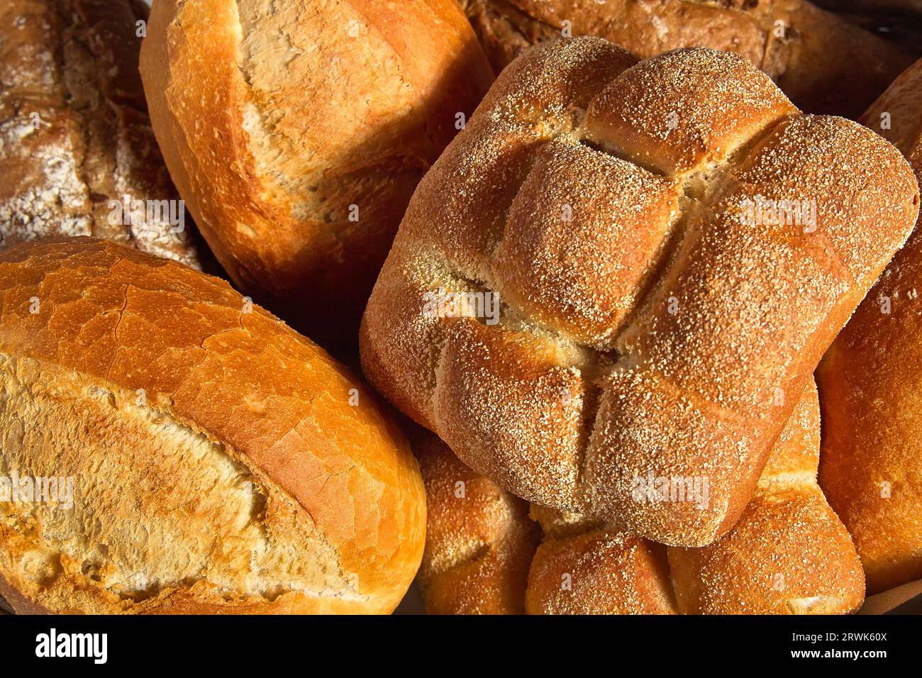 Different types of bread in one basket Stock Photo - Alamy