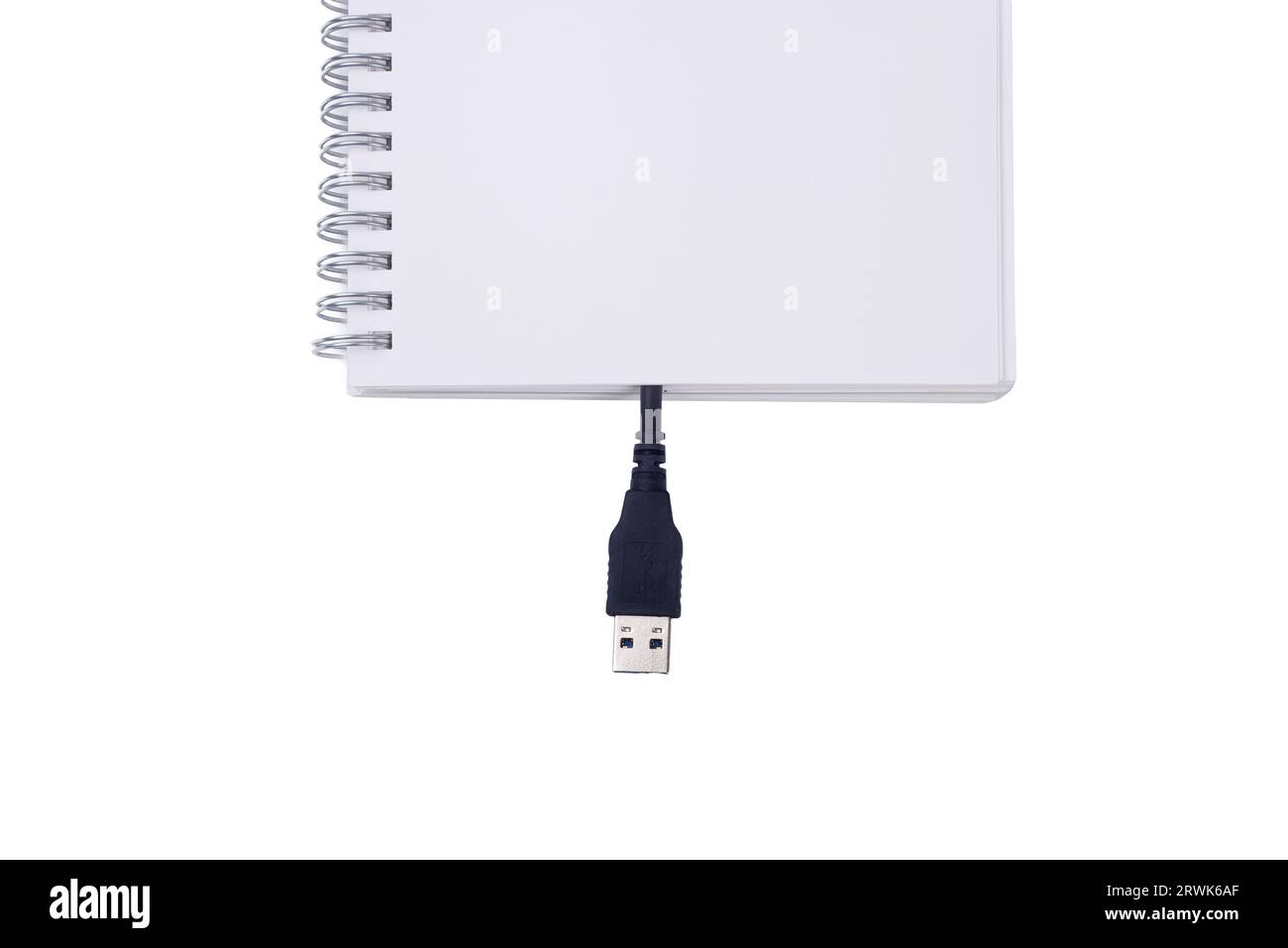 a book with a USB plug coming out of its pages on a transparent ...