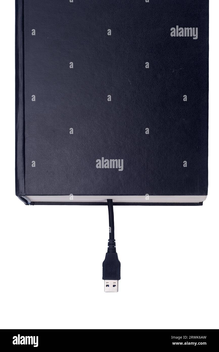 a book with a USB plug coming out of its pages on a transparent ...