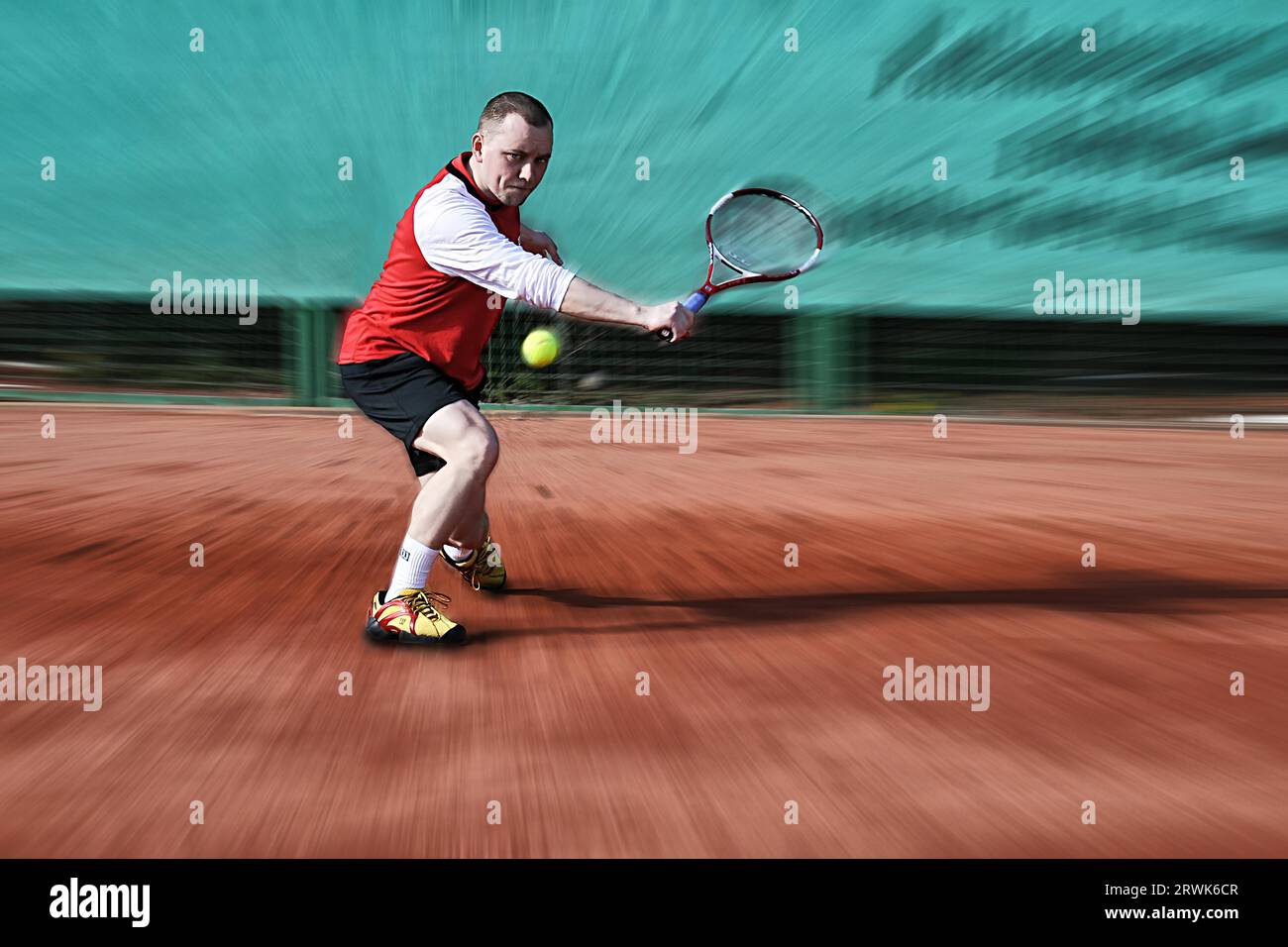 Tennis player hits backhand slice Stock Photo - Alamy