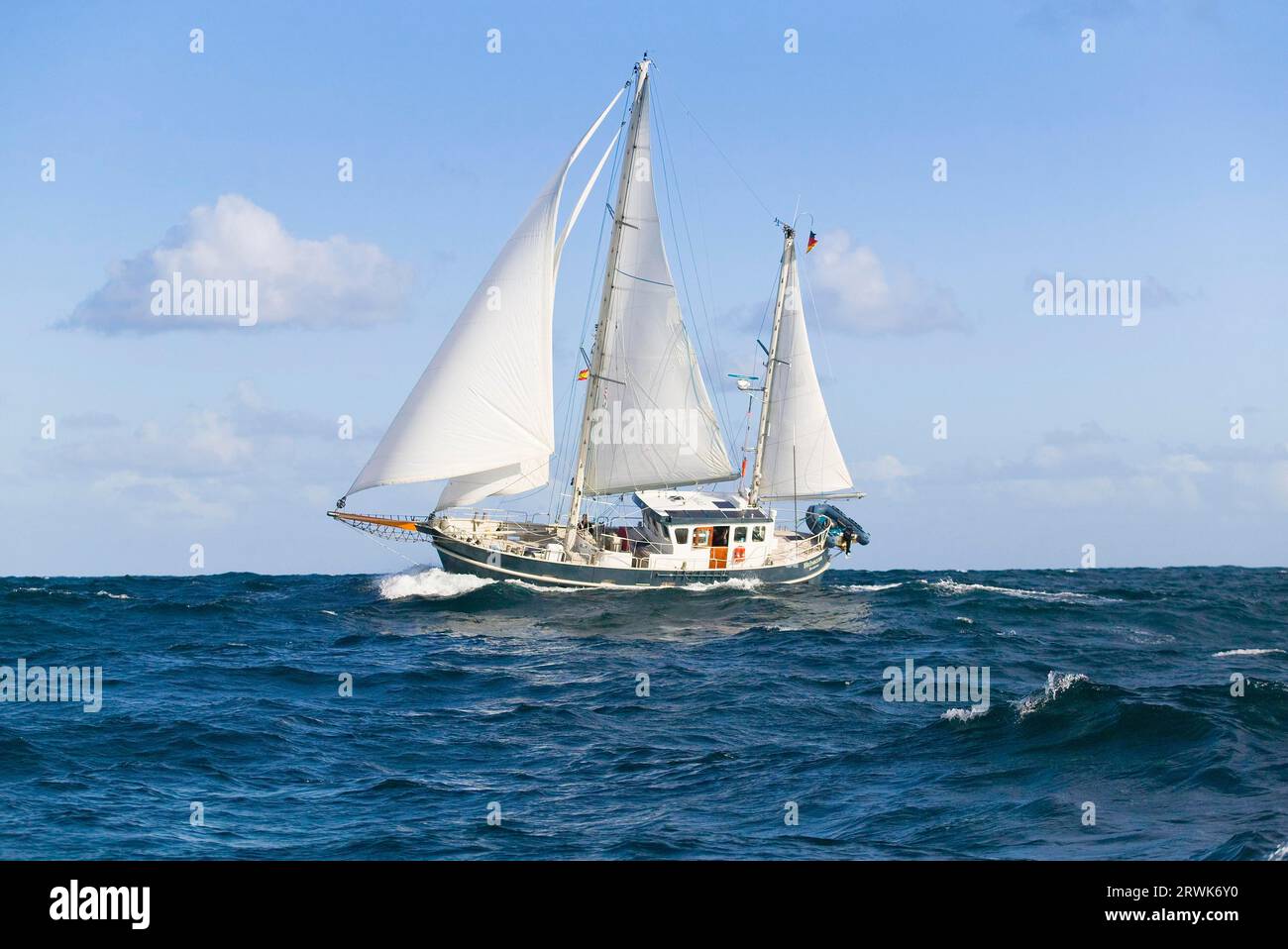 Yacht in high seas Stock Photo - Alamy