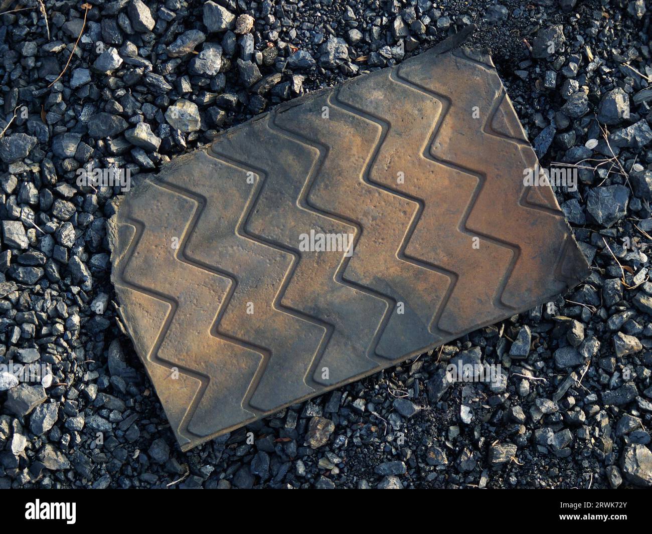 Rubber profile plate, background coals on mine site Stock Photo - Alamy