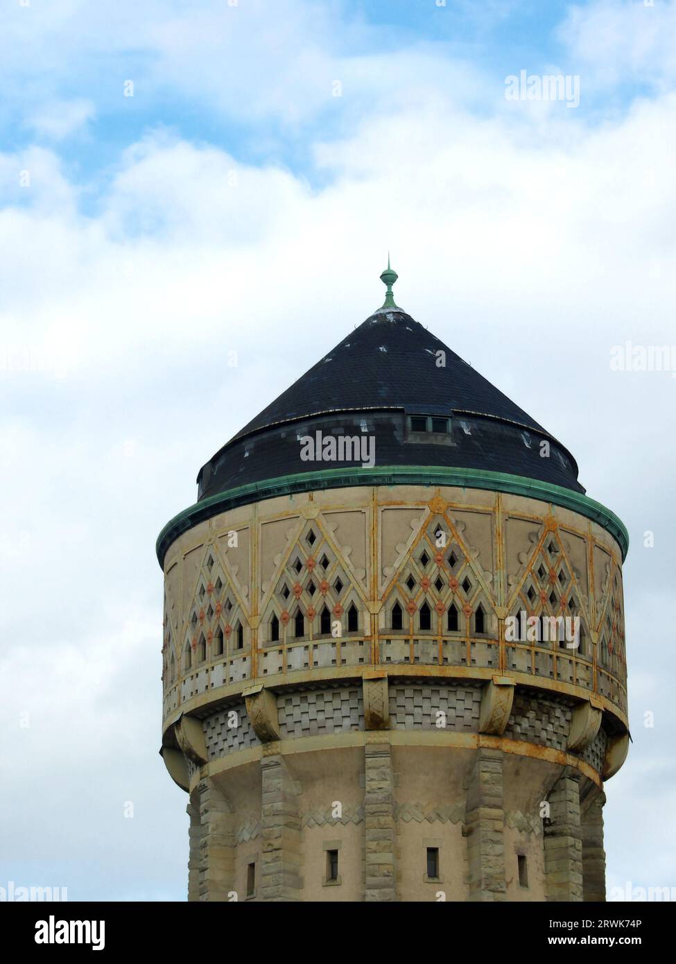 Rare beautiful water tower with stone decorations and a black roof ...