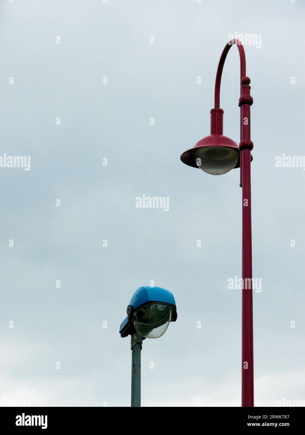 Two different street lamps in red and blue, detail Stock Photo - Alamy