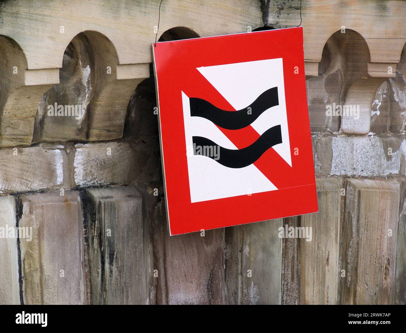 Red and white navigation sign attached to a bridge Stock Photo - Alamy