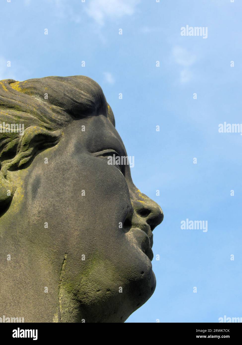 Female stone portrait, background, blue sky Stock Photo - Alamy