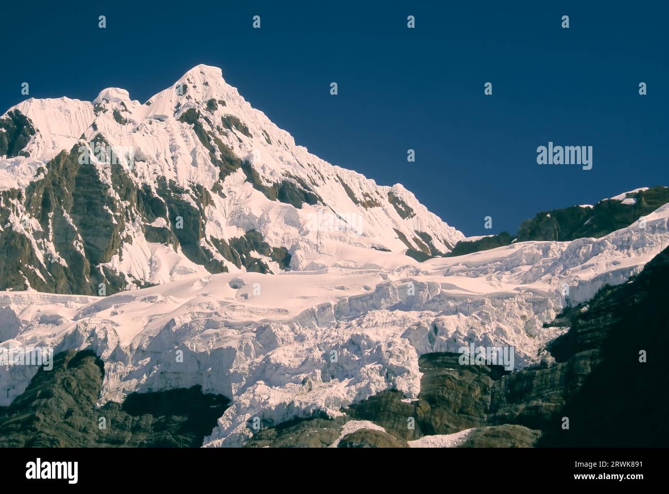 Majestic peak covered by snow in Peruvian Andes, Cordillera Blanca ...
