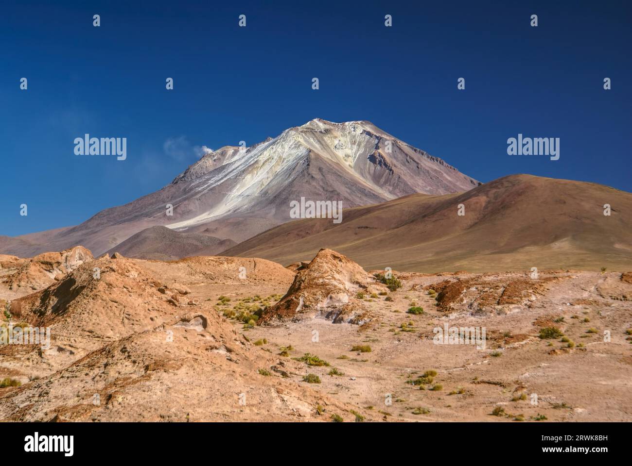 Picturesque volcano near salt planes Salar de Uyuni in bolivian desert ...