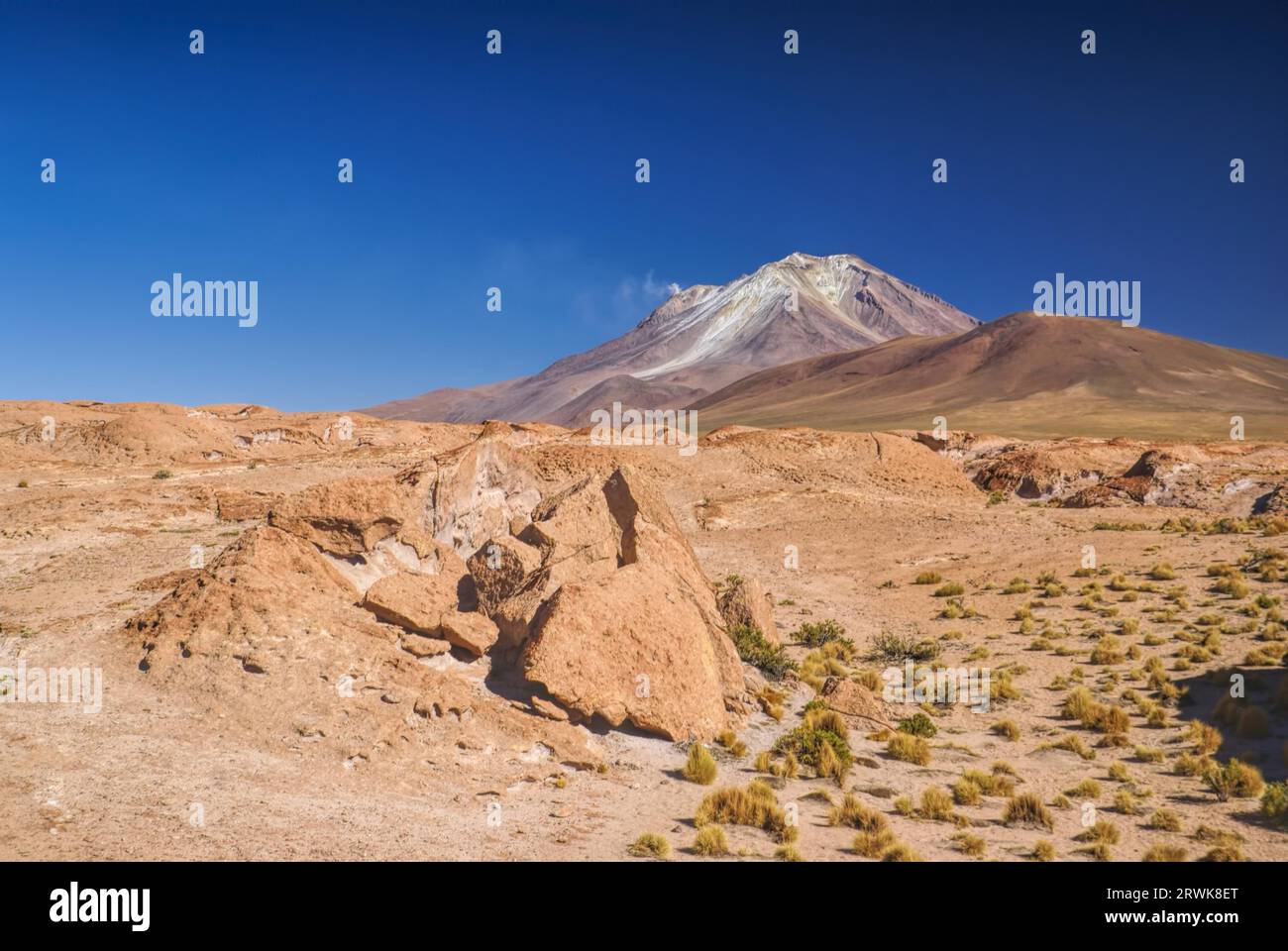 Picturesque volcano near salt planes Salar de Uyuni in bolivian desert ...