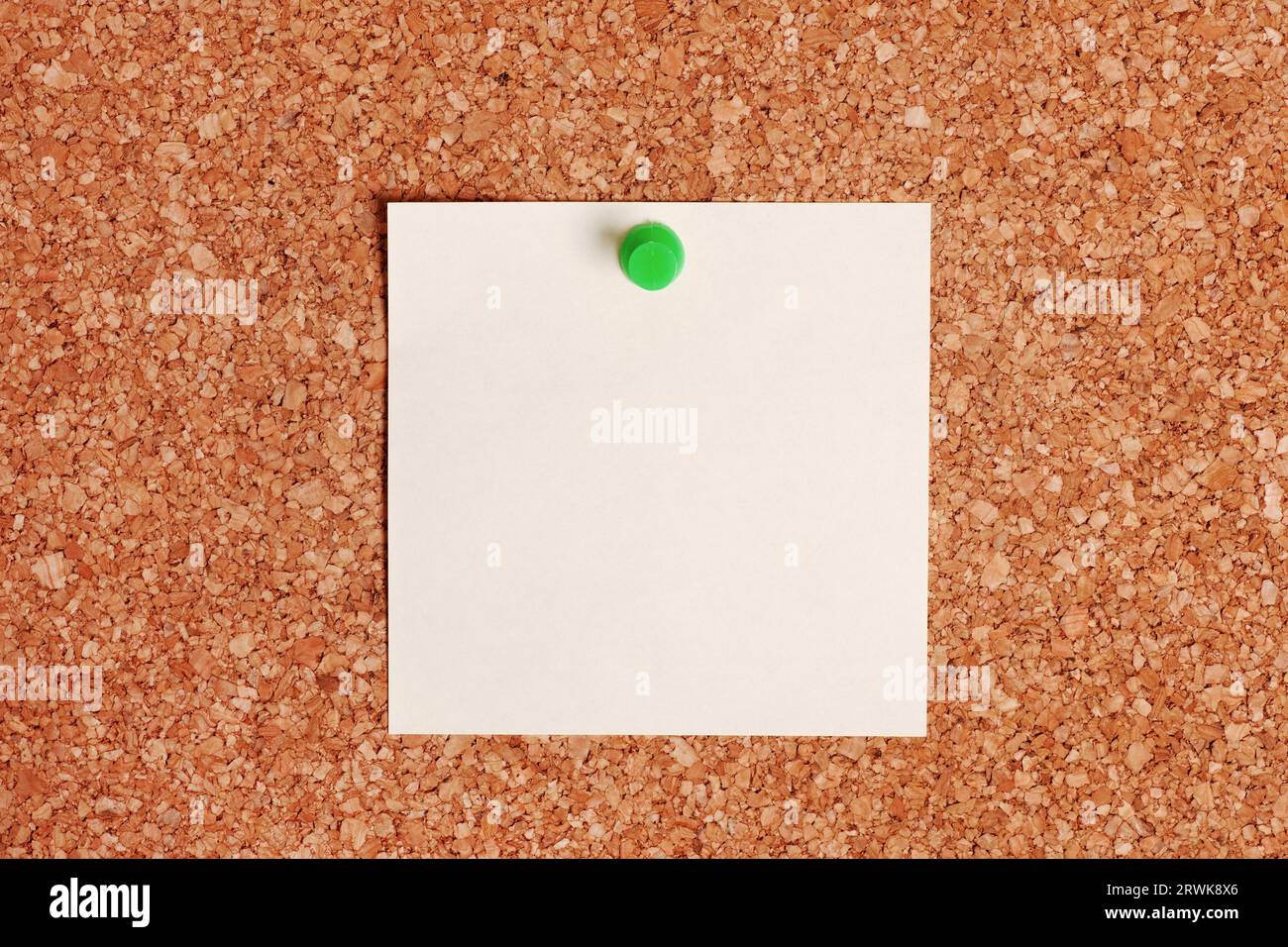 Note paper with push pin on corkboard Stock Photo - Alamy