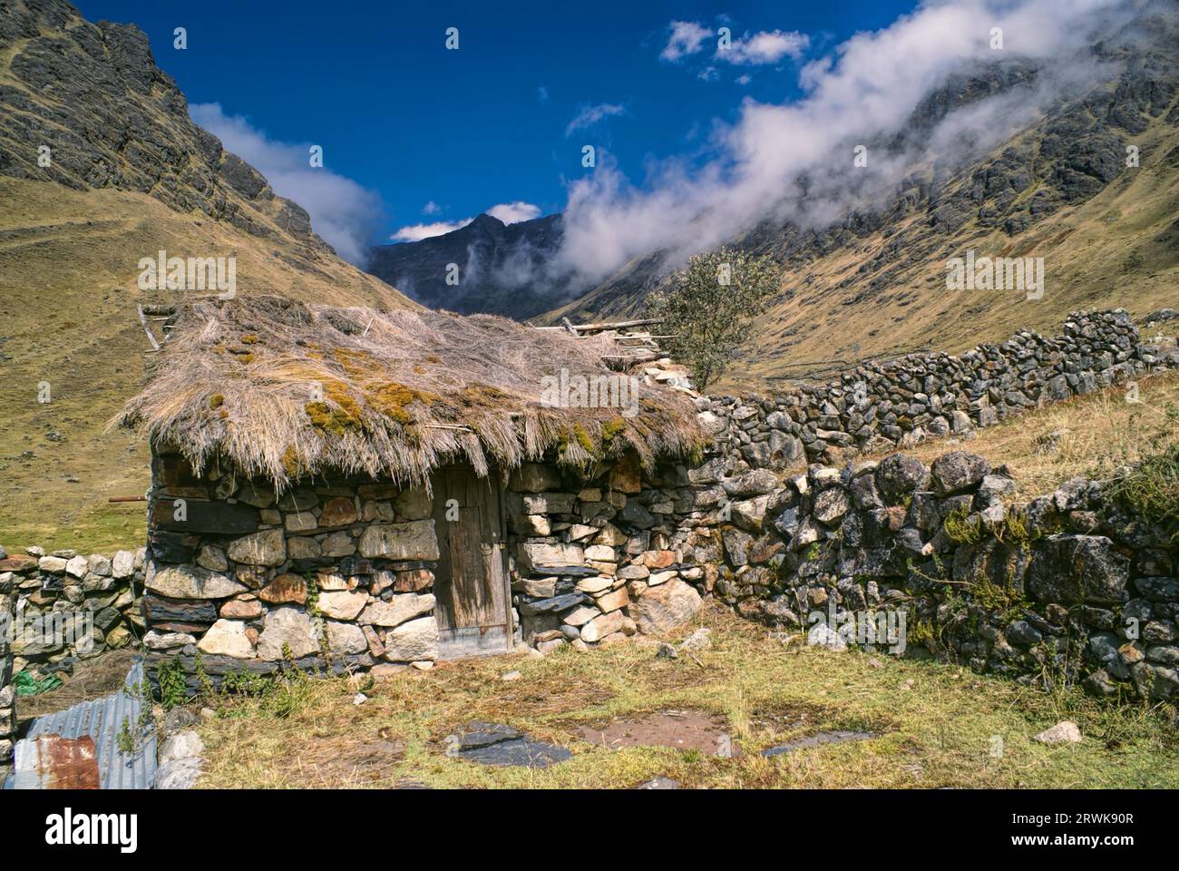 Traditional old stone hut in Andes mountains in Bolivia on Choro trek ...
