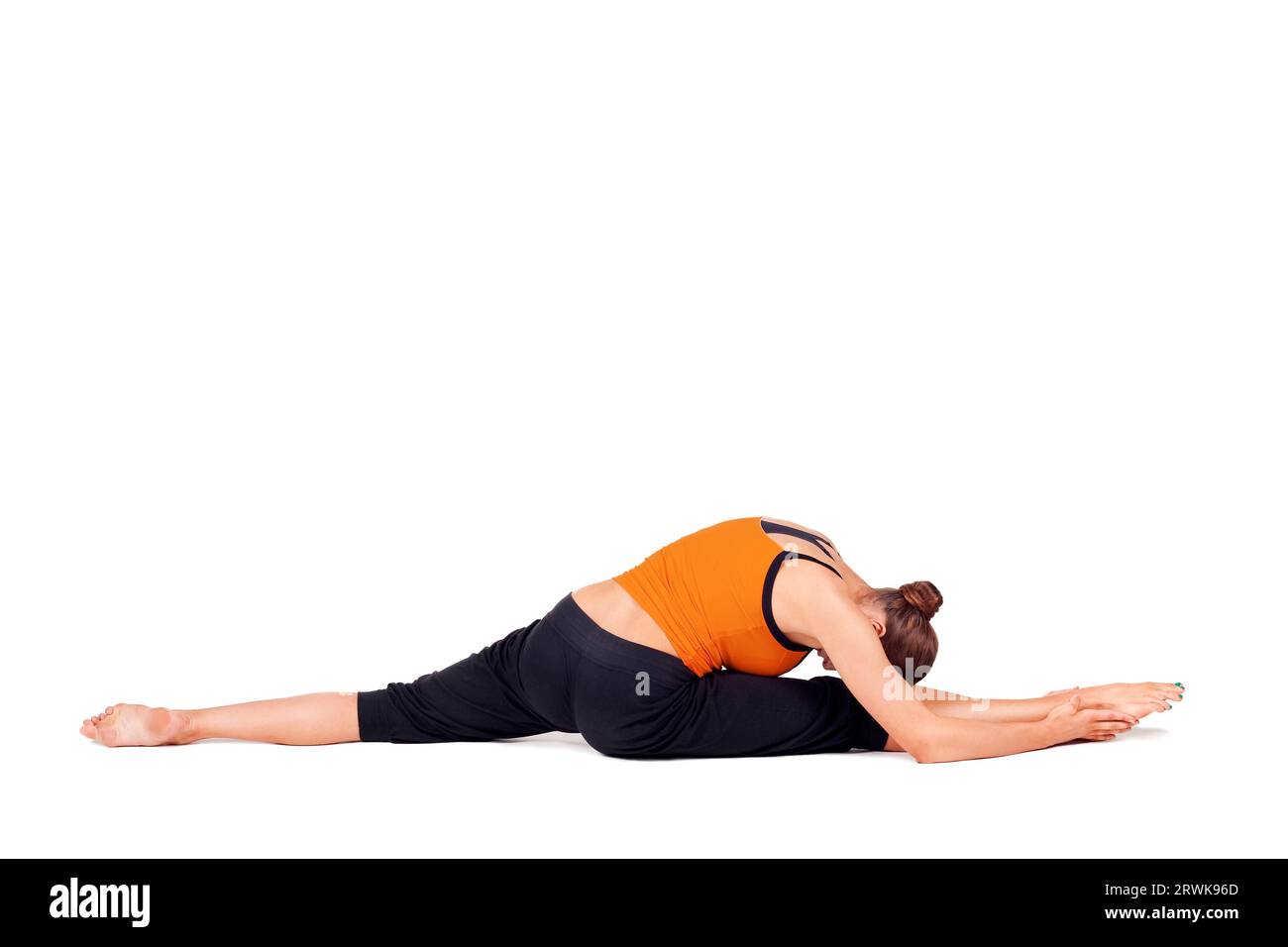 Woman practicing yoga exercise called Monkey God Pose, version B ...