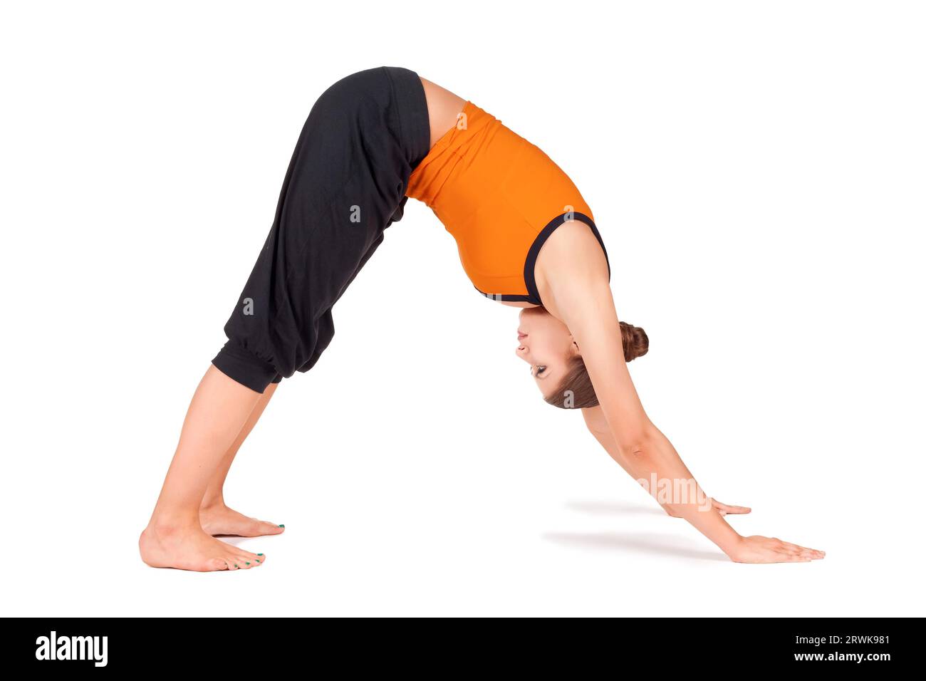 Woman doing yoga exercise called Downward Facing Dog, sanskrit name ...