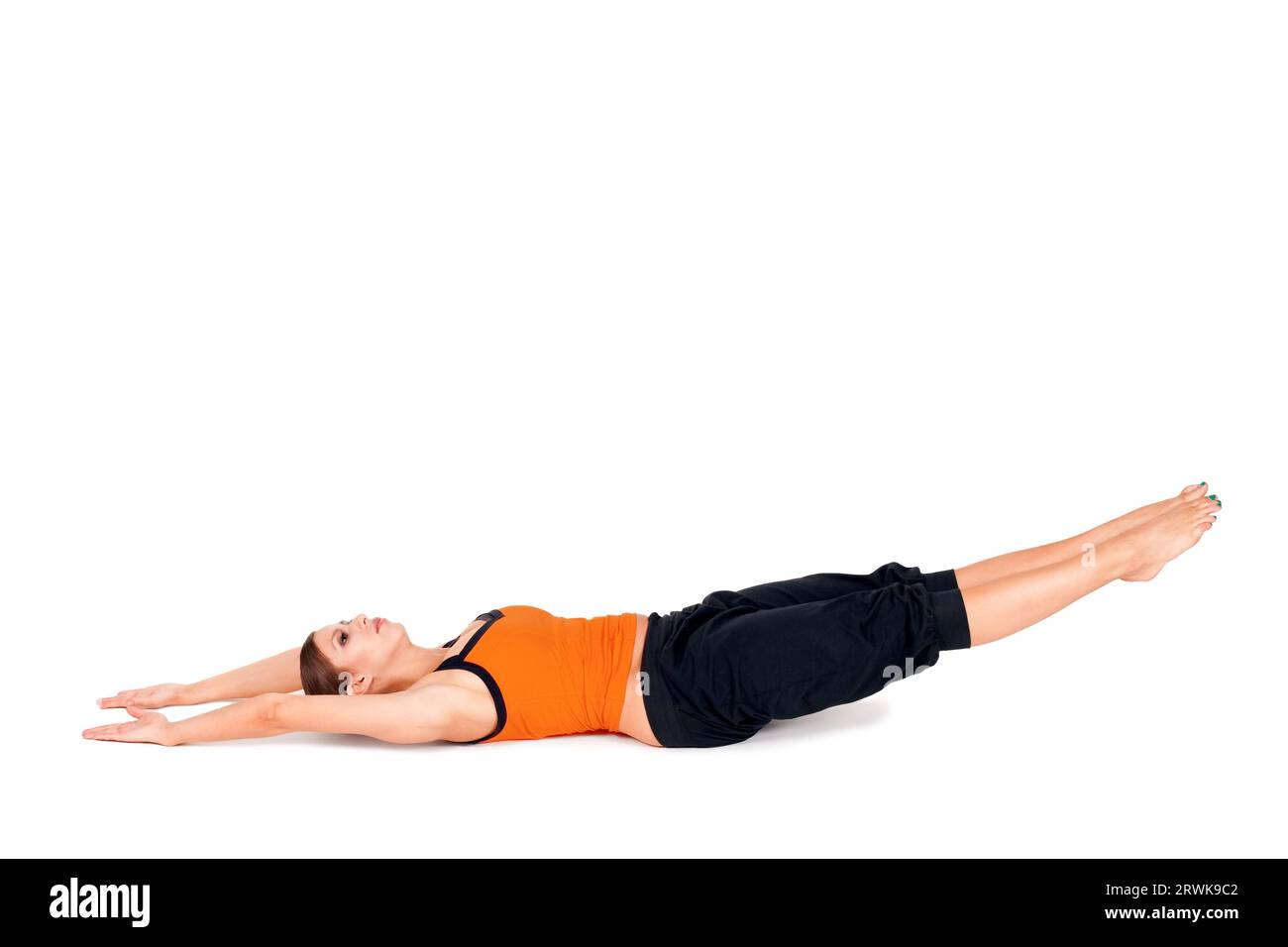 Woman doing first stage of yoga exercise called: Upward Extended Feet ...