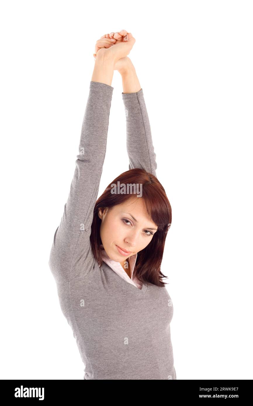 Attractive tired young woman stretching out her arms, isolated on white ...