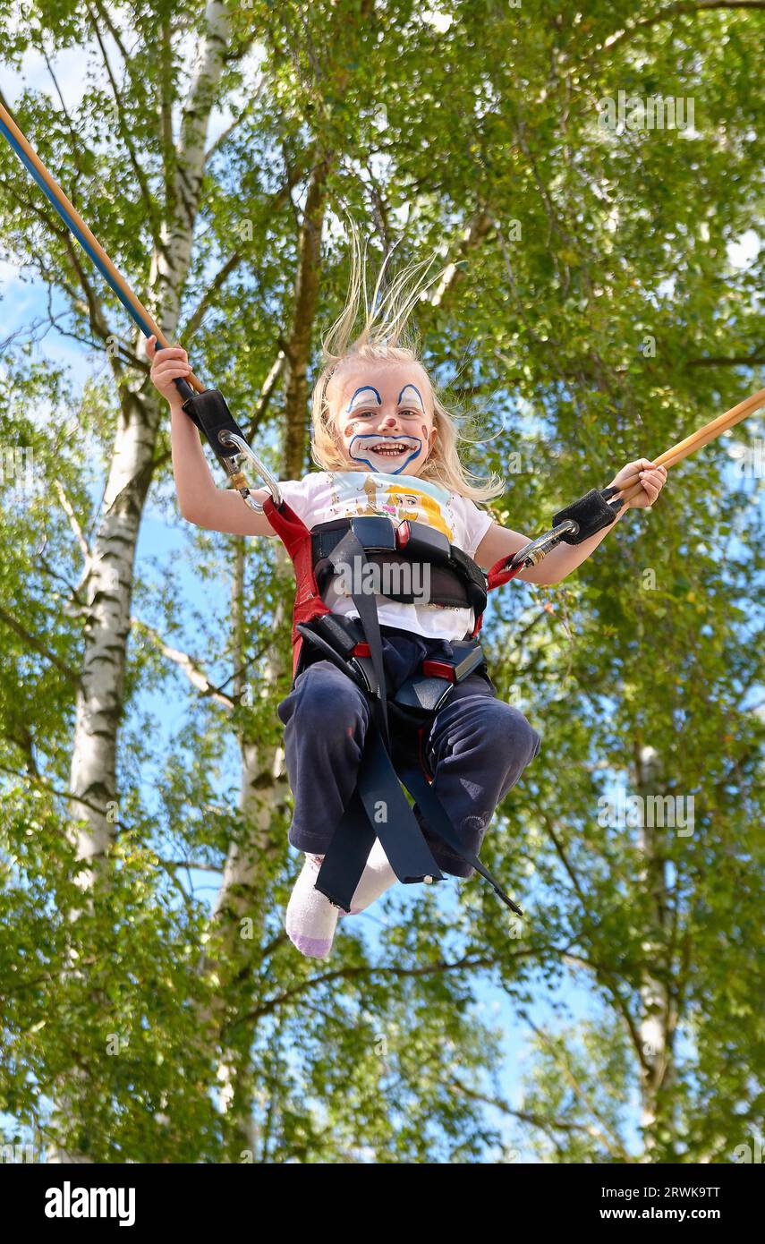 Child clown jumping Stock Photo - Alamy