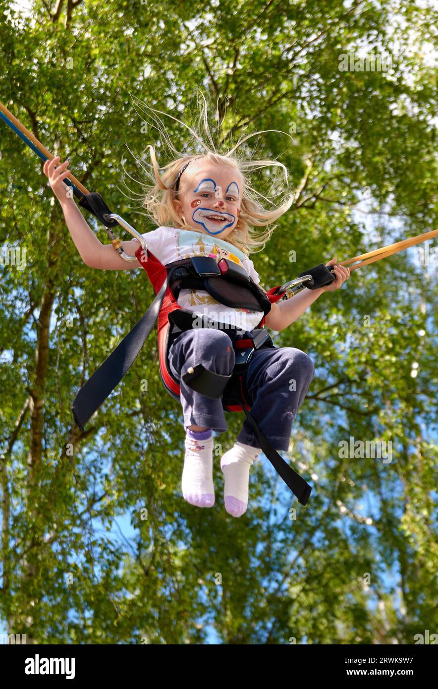 Child clown jumping Stock Photo - Alamy